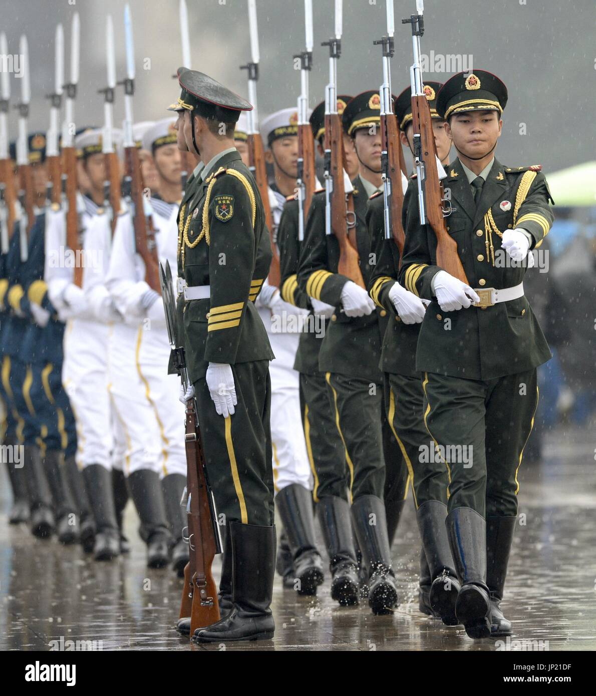 BEIJING, China - Police officers march during a ceremony at Tiananmen ...