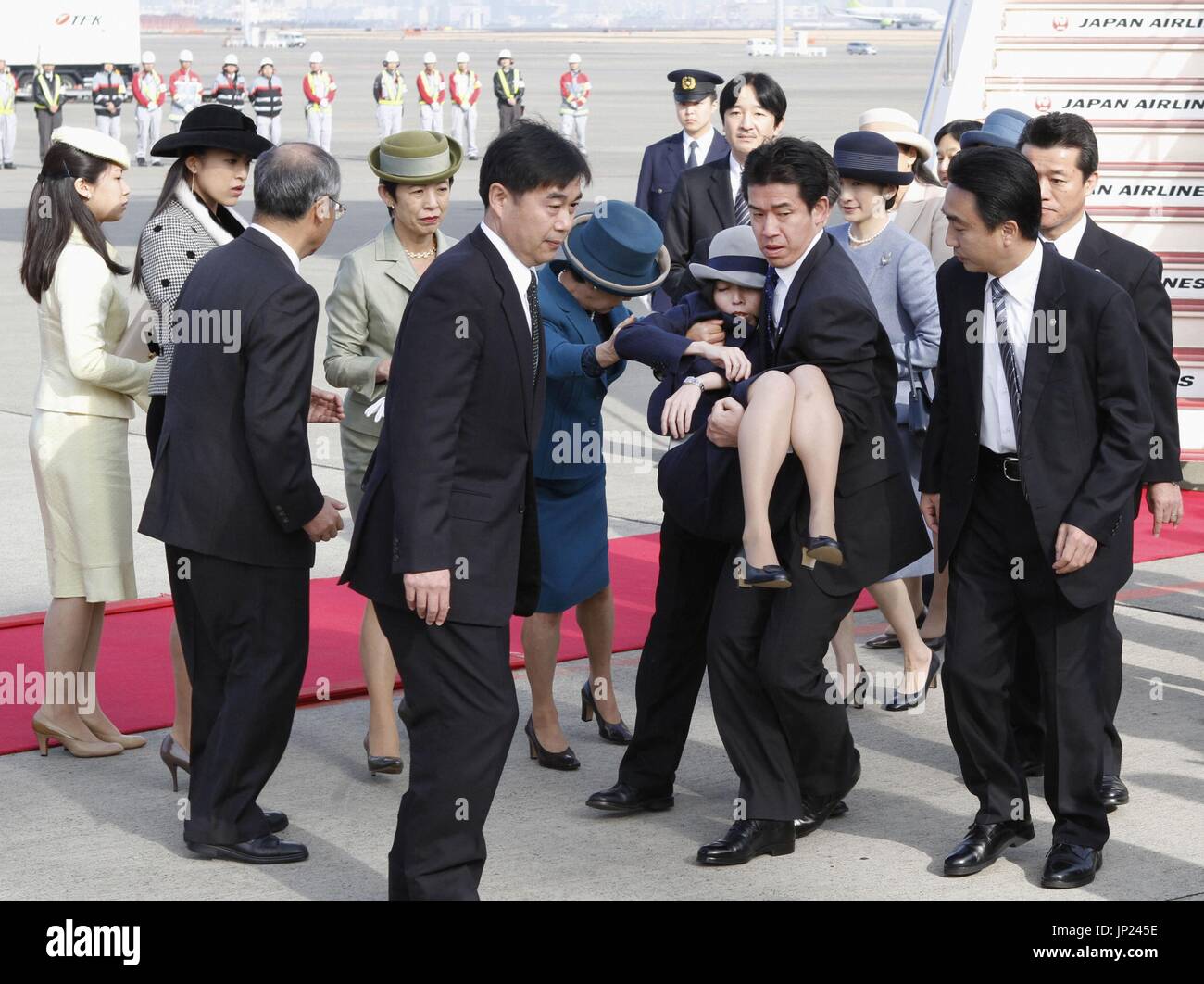 TOKYO, Japan - Japanese Princess Akiko is carried by security guards ...