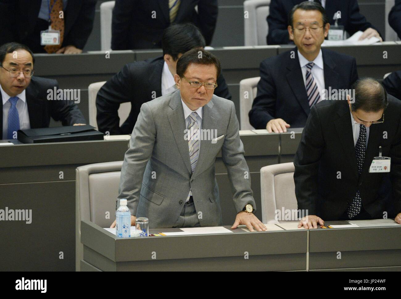 TOKYO, Japan - Tokyo Gov. Naoki Inose (L front) bows after his ...