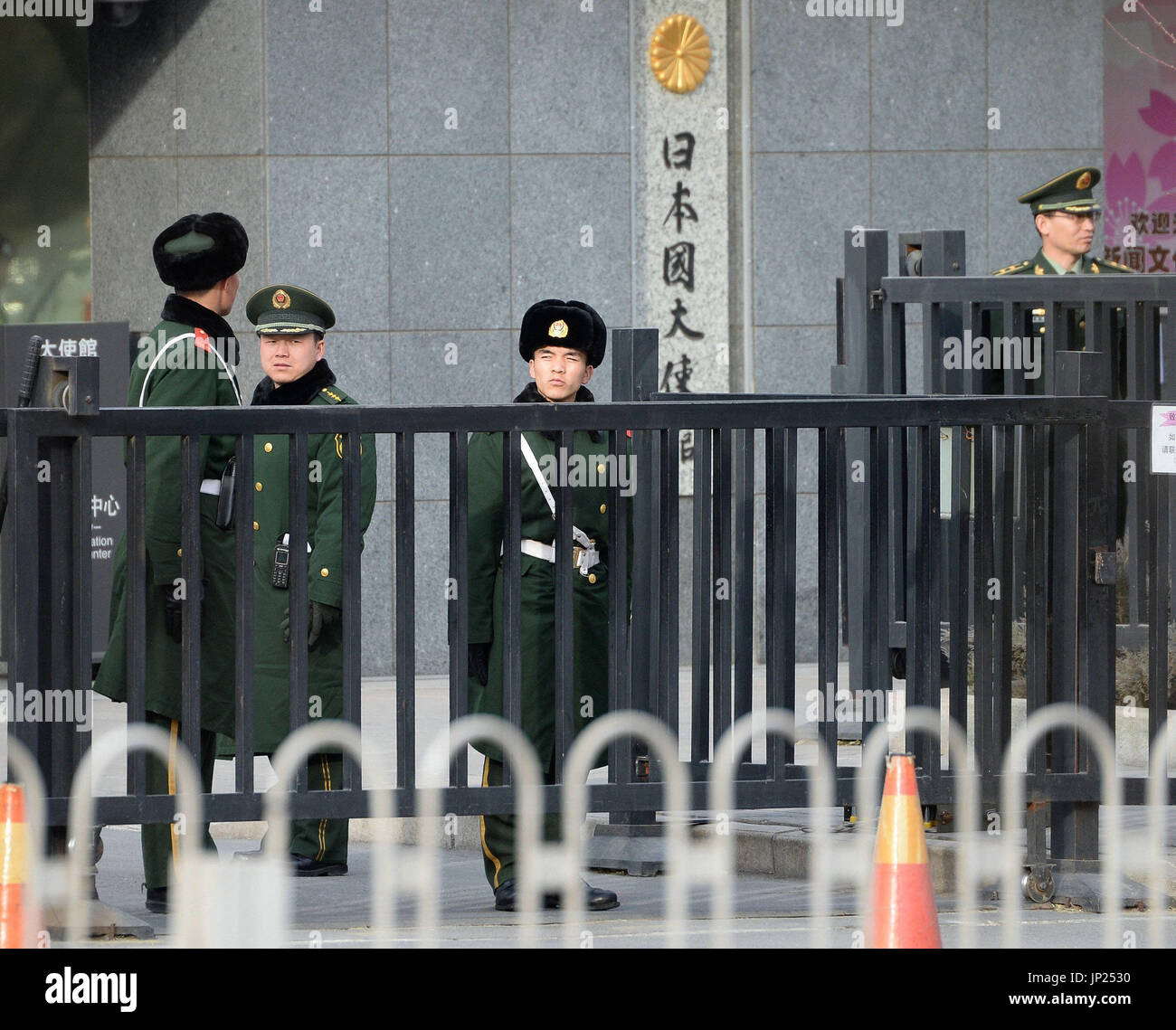 BEIJING, China - Police officers stand guard in front of the Japanese ...