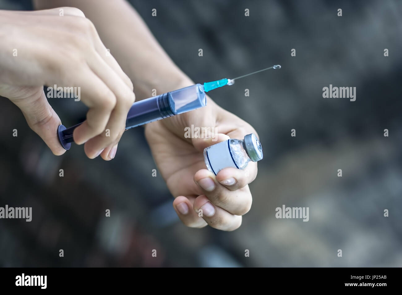 Syringe, medical injection, bottle, ampule in hand, palm or fingers ...