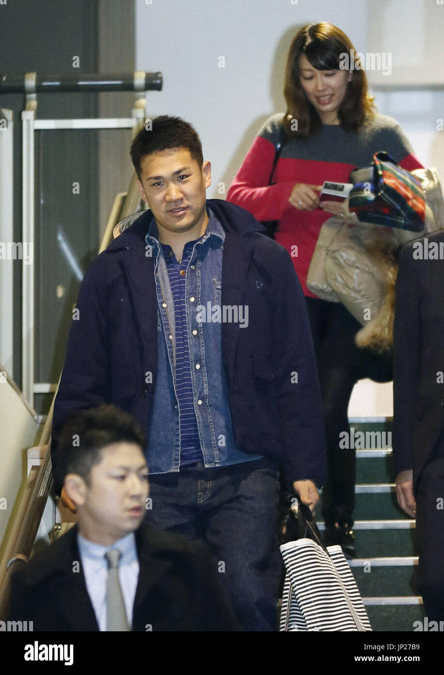 NARITA, Japan - Right-hander Masahiro Tanaka (C) and his wife Mai ...