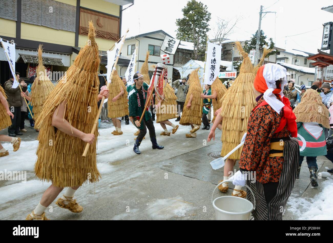 YAMAGATA, Japan - Participants dressed in traditional straw coats dance ...