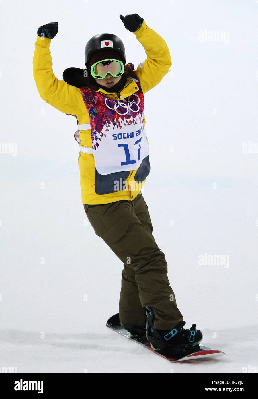 SOCHI, Russia - Rana Okada of Japan raises her arms after finishing her ...