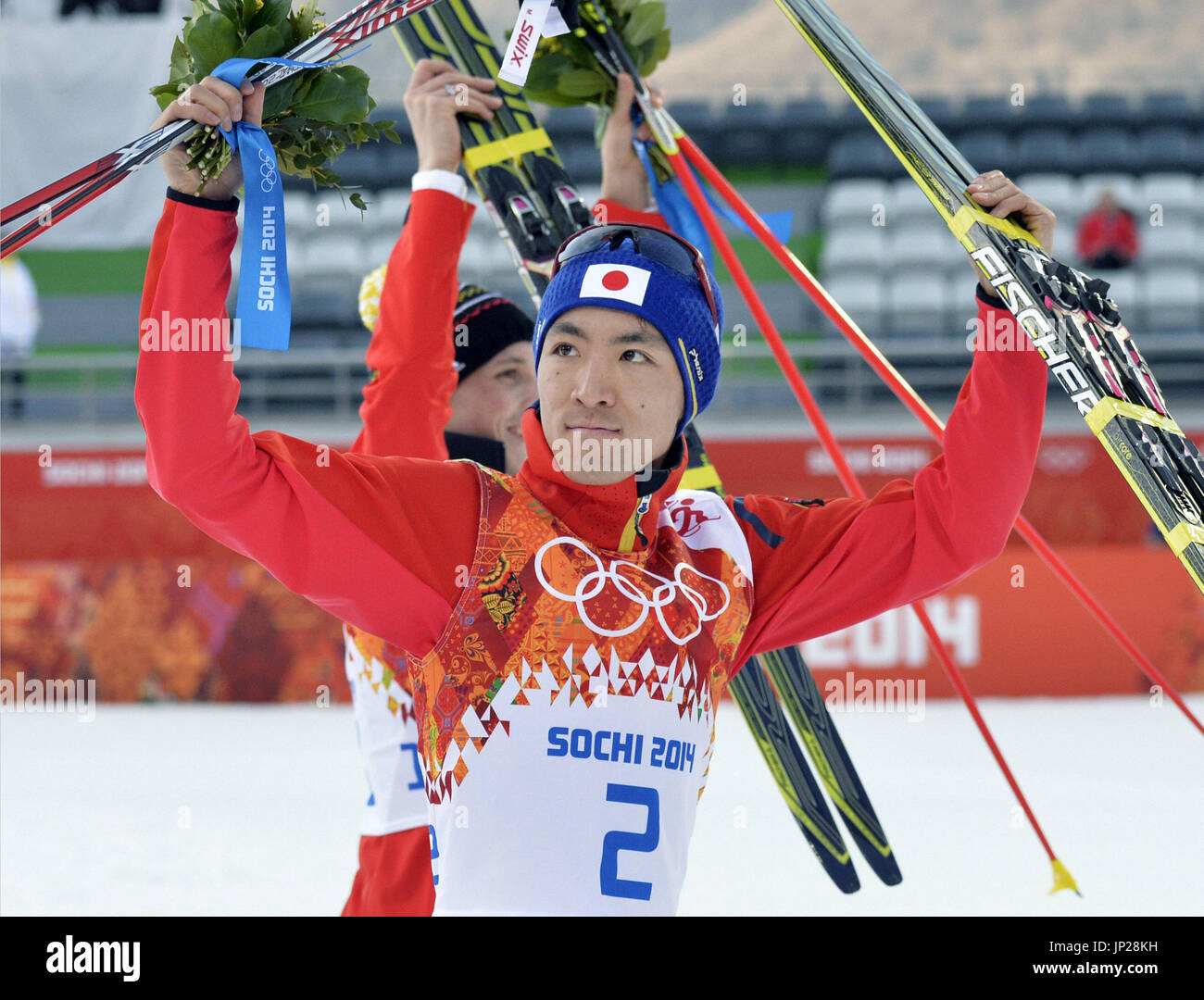 SOCHI, Russia - Japan's Akito Watabe raises his hands in ...
