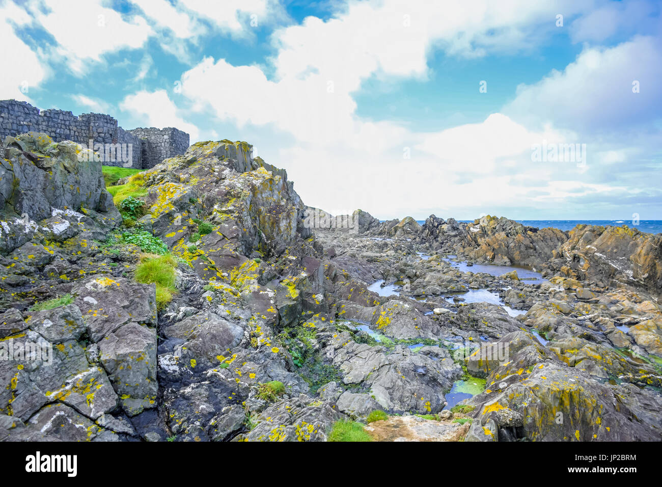 Landscape of Peel Hill rocky seashore in Isle of Man Stock Photo - Alamy