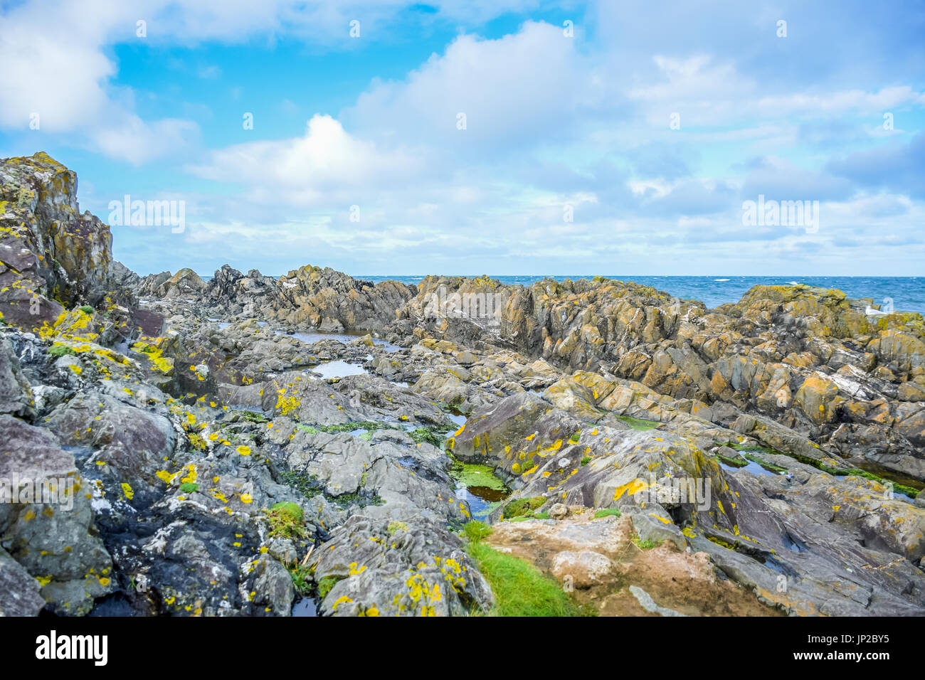 Landscape view of Peel hill rocky seashore, Isle of Man Stock Photo - Alamy