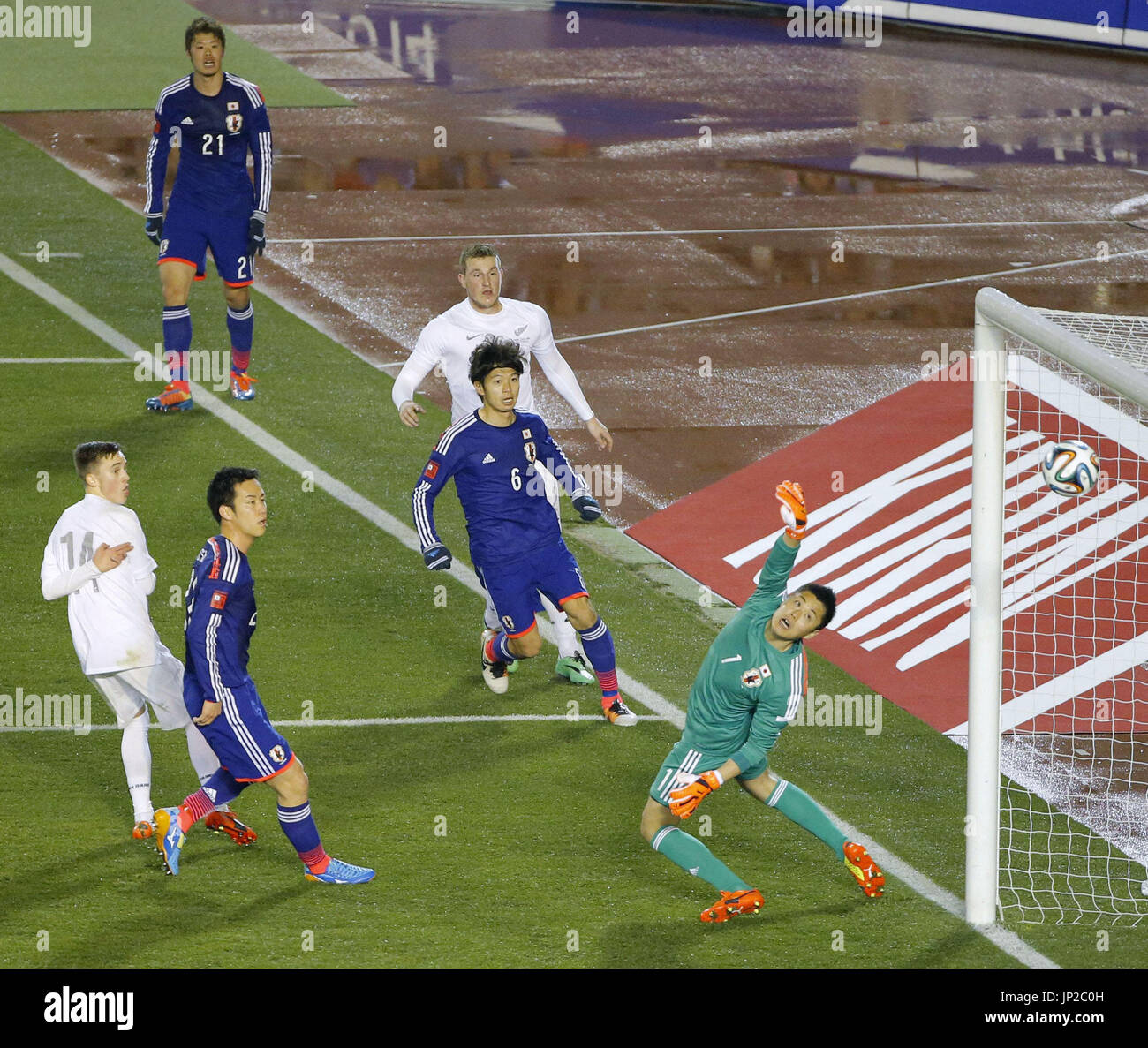 TOKYO, Japan - Japanese goalkeeper Eiji Kawashima (lower R) and ...