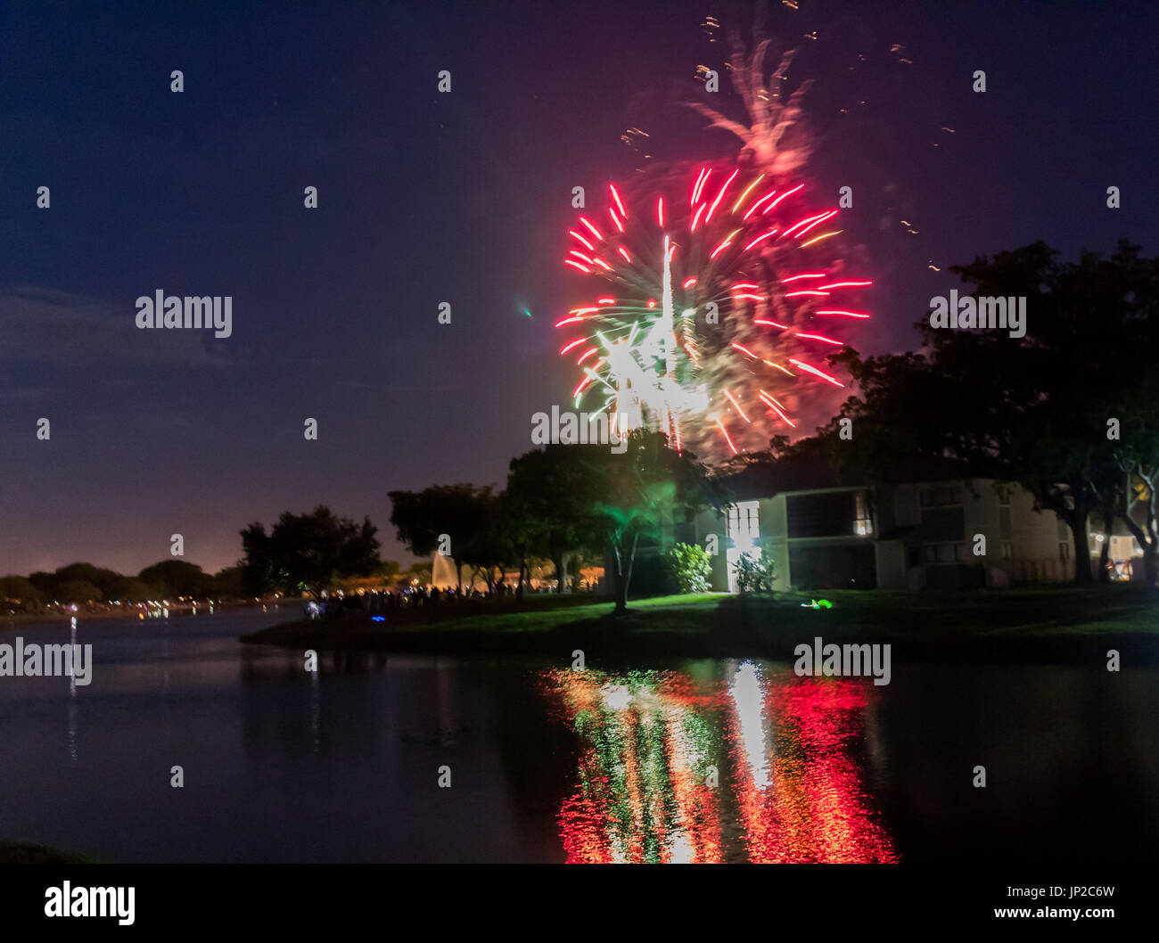 Fireworks over a lake side view on the 4th of July Stock Photo - Alamy