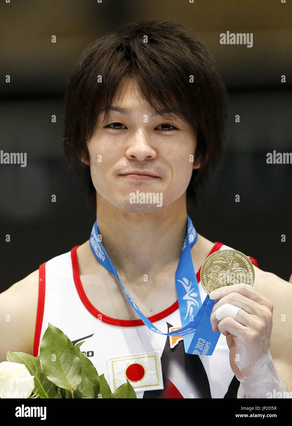 ANTWERP, Belgium - Japan's Kohei Uchimura holds his gold medal after becoming the first gymnast ...