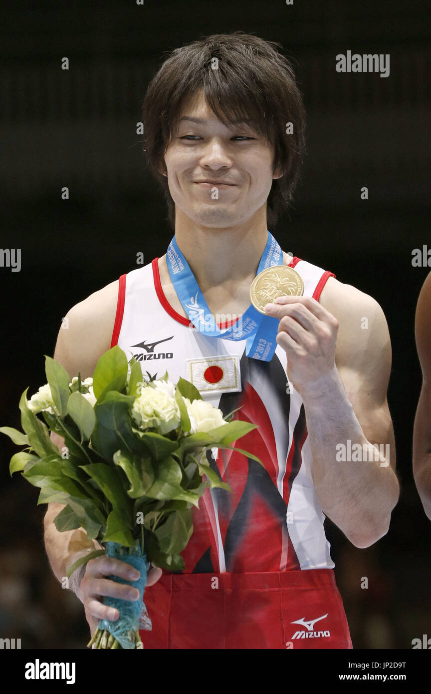 ANTWERP, Belgium - Japan's Kohei Uchimura holds the gold medal he won in the men's parallel bars ...