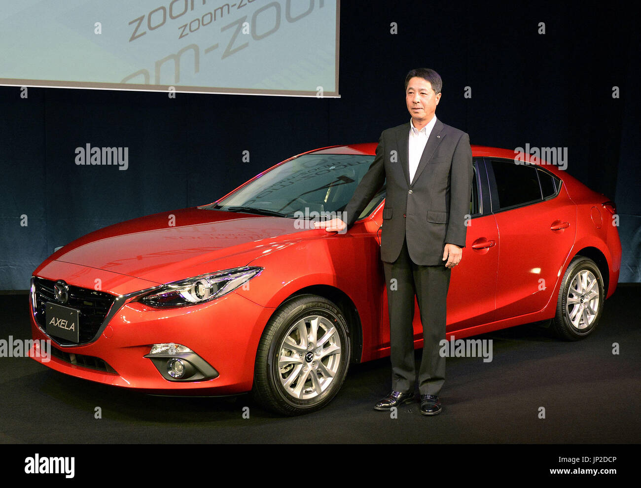 TOKYO, Japan - Mazda Motor Corp. President Masamichi Kogai stands by a ...