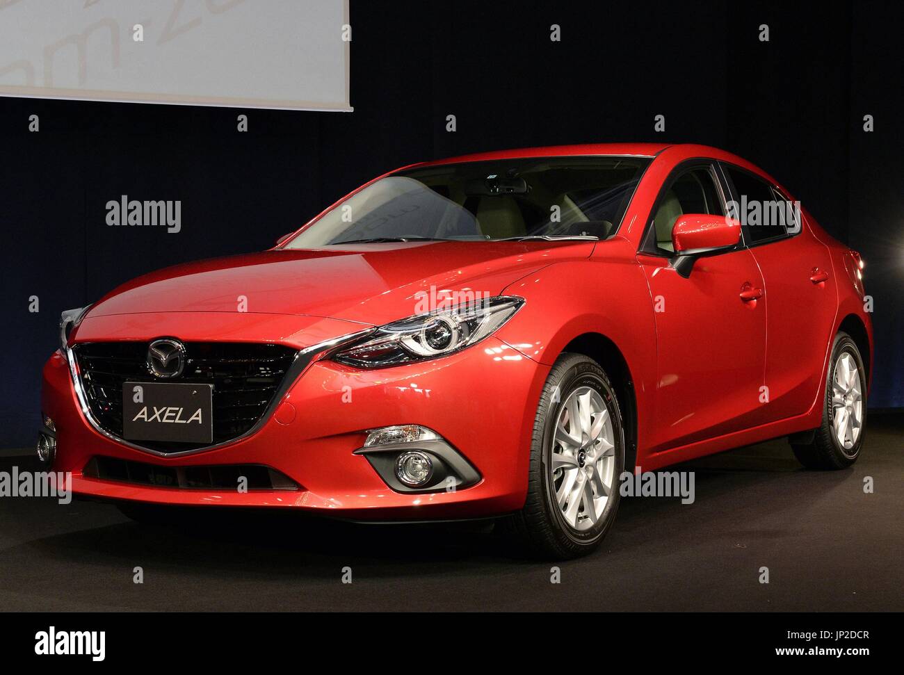 TOKYO, Japan - Mazda Motor Corp. unveils a hybrid version of the Axela ...