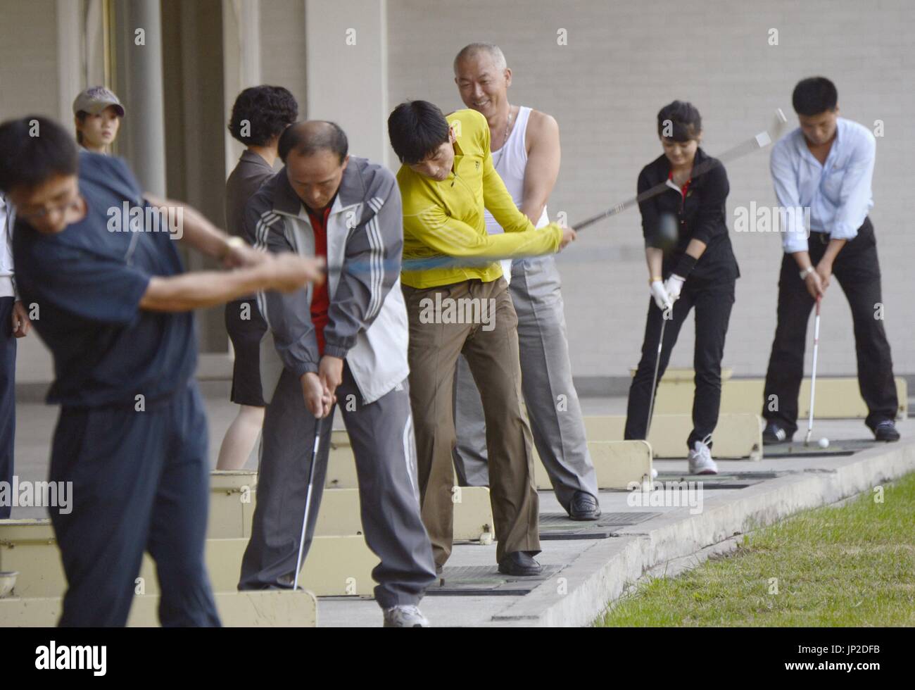 PYONGYANG, North Korea - People practice at a renovated golf driving ...