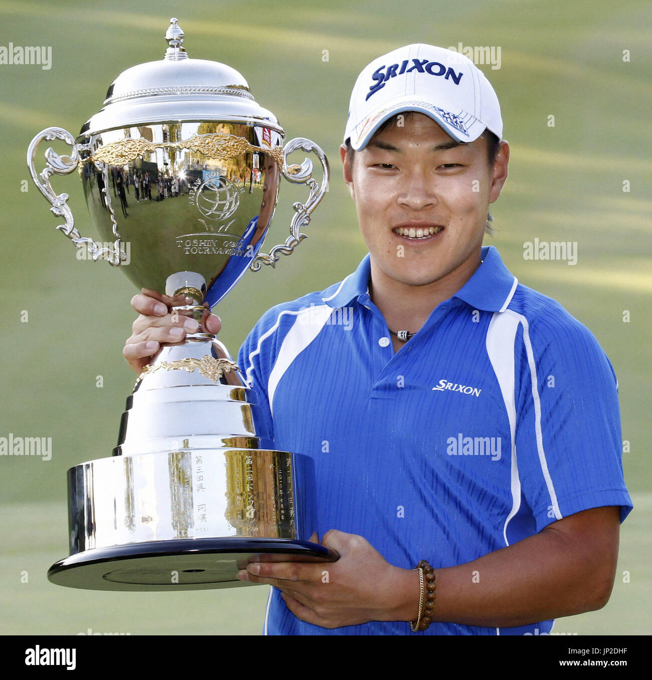 GIFU, Japan - Japan's Yoshinori Fujimoto holds the victor's trophy ...