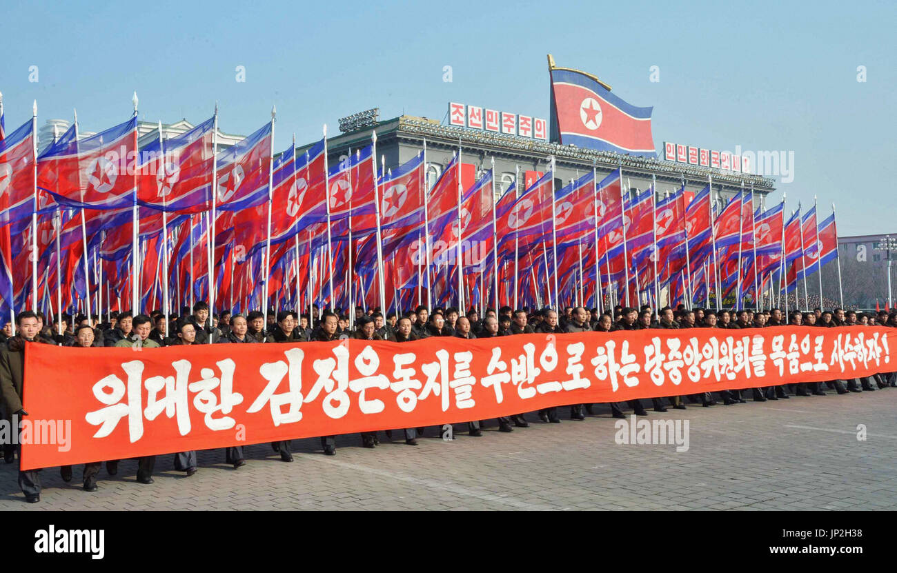 PYONGYANG, North Korea - Holding a banner with a slogan calling for ...