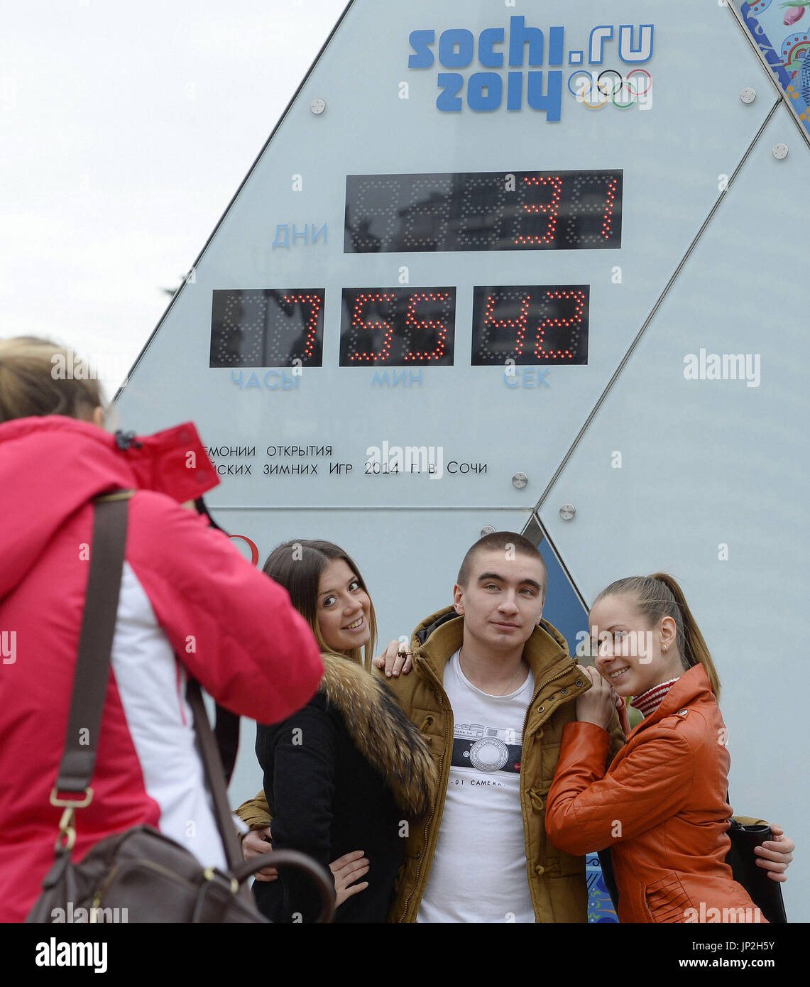 SOCHI, Russia - People pose for a photo at an Olympic countdown board ...
