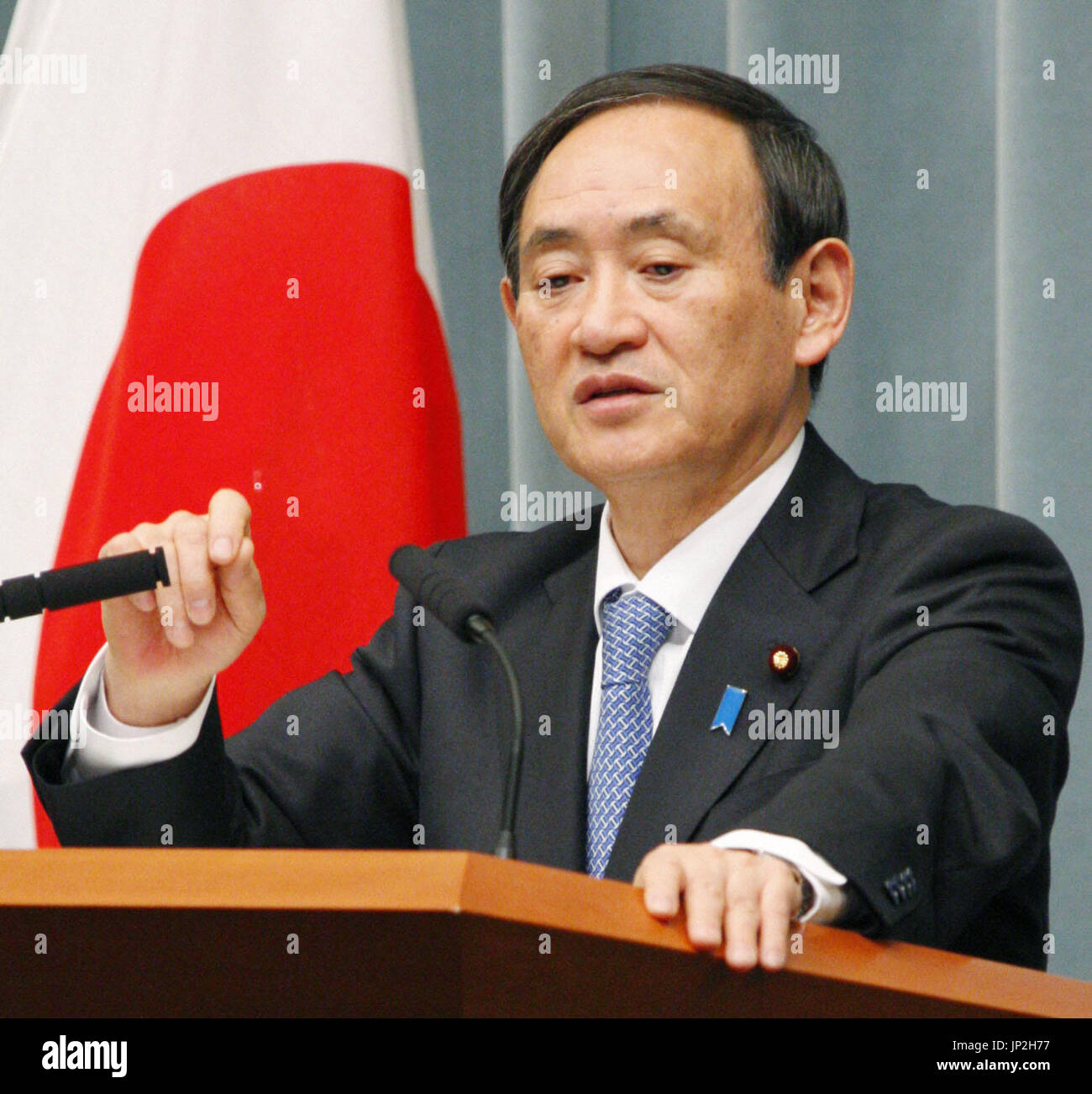 TOKYO, Japan - Chief Cabinet Secretary Yoshihide Suga tells a press ...