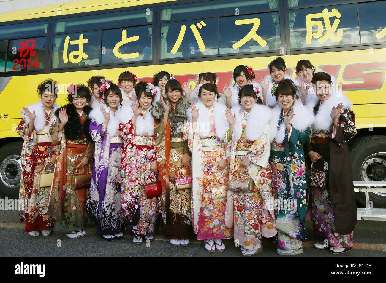 TOKYO, Japan - Sightseeing tour guides of Hato Bus Co. pose for photos ...