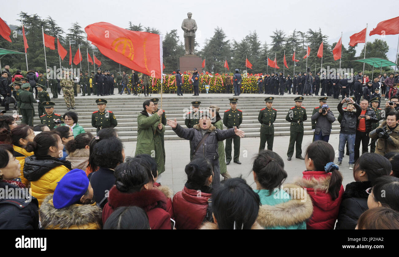 SHAOSHAN, China - Masses of people gather at a statue of Mao Zedong ...
