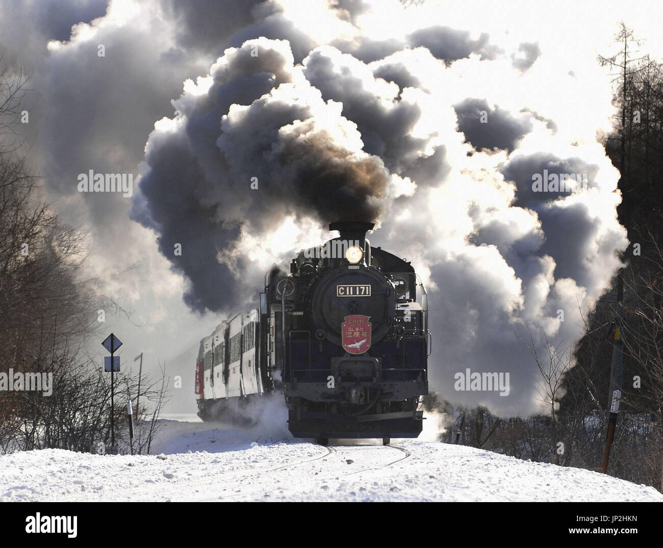 TESHIKAGA, Japan - A steam locomotive runs through the snow-covered ...