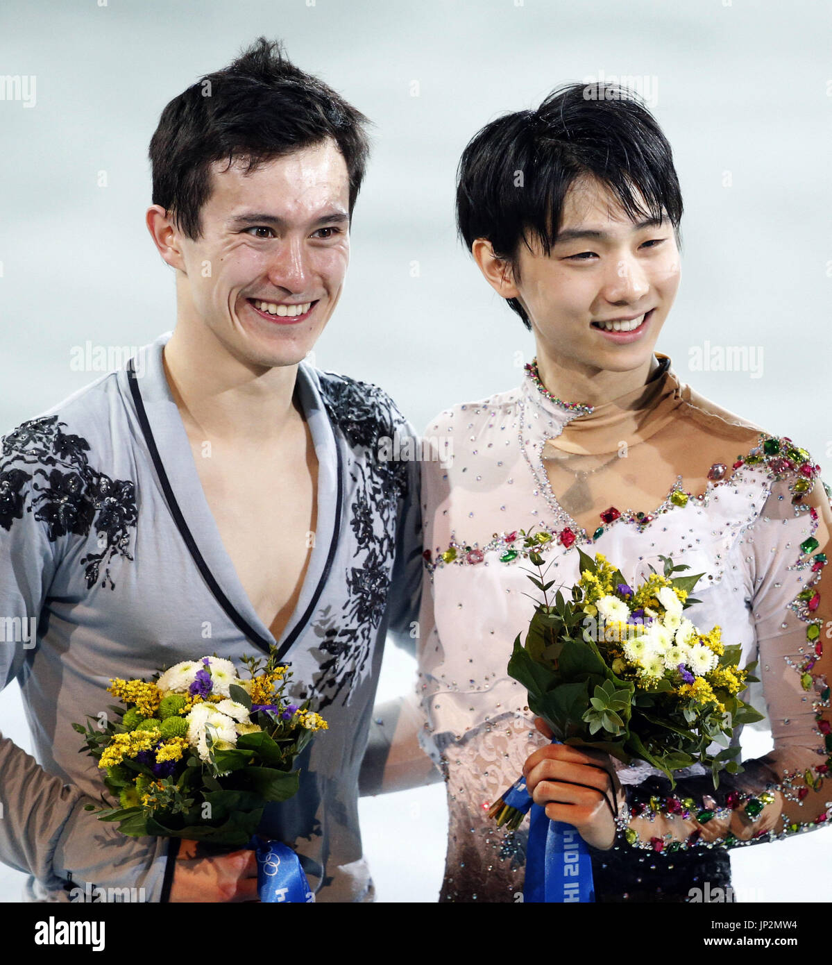 SOCHI, Russia - Japan's Yuzuru Hanyu (R) and Canada's Patrick Chan ...