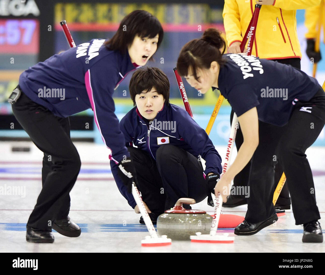 SOCHI, Russia - Japan's Michiko Tomabechi (C) delivers the stone to ...