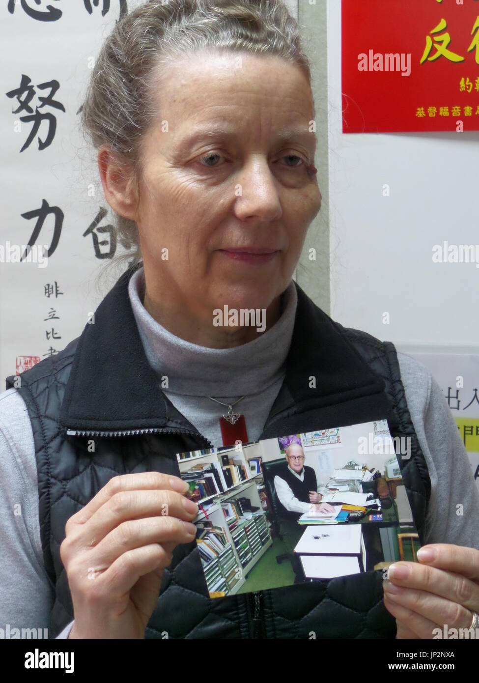 HONG KONG, China - Karen Short holds a photo of her husband, Australian ...