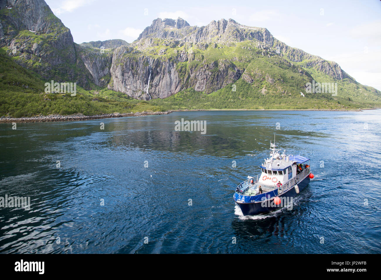 Small tourist boat in mountainous fiord landscape, Raftsundet strait ...