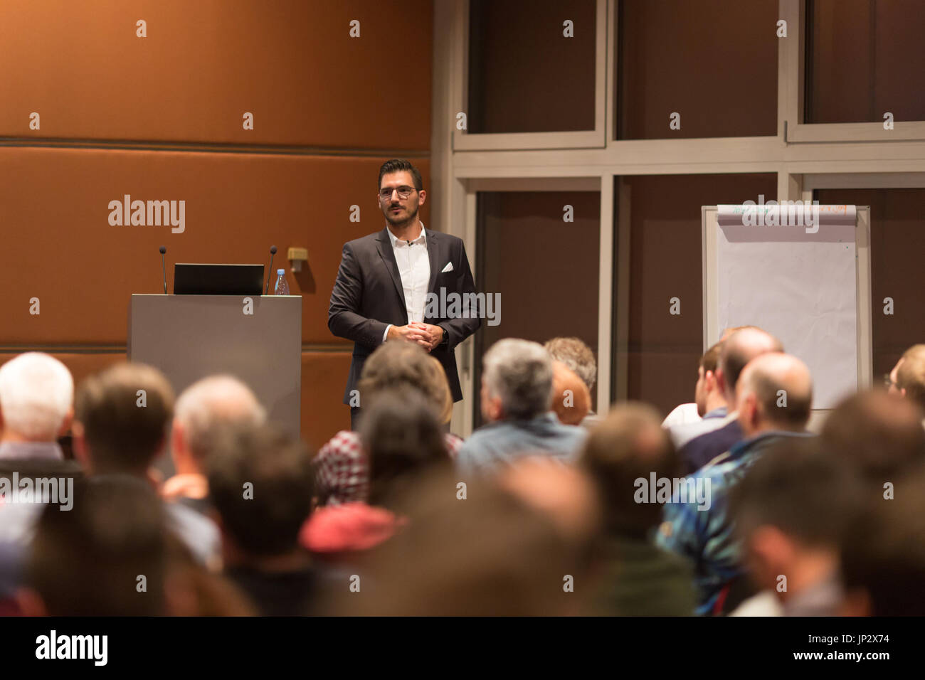 Business speaker giving a talk at conference meeting Stock Photo - Alamy