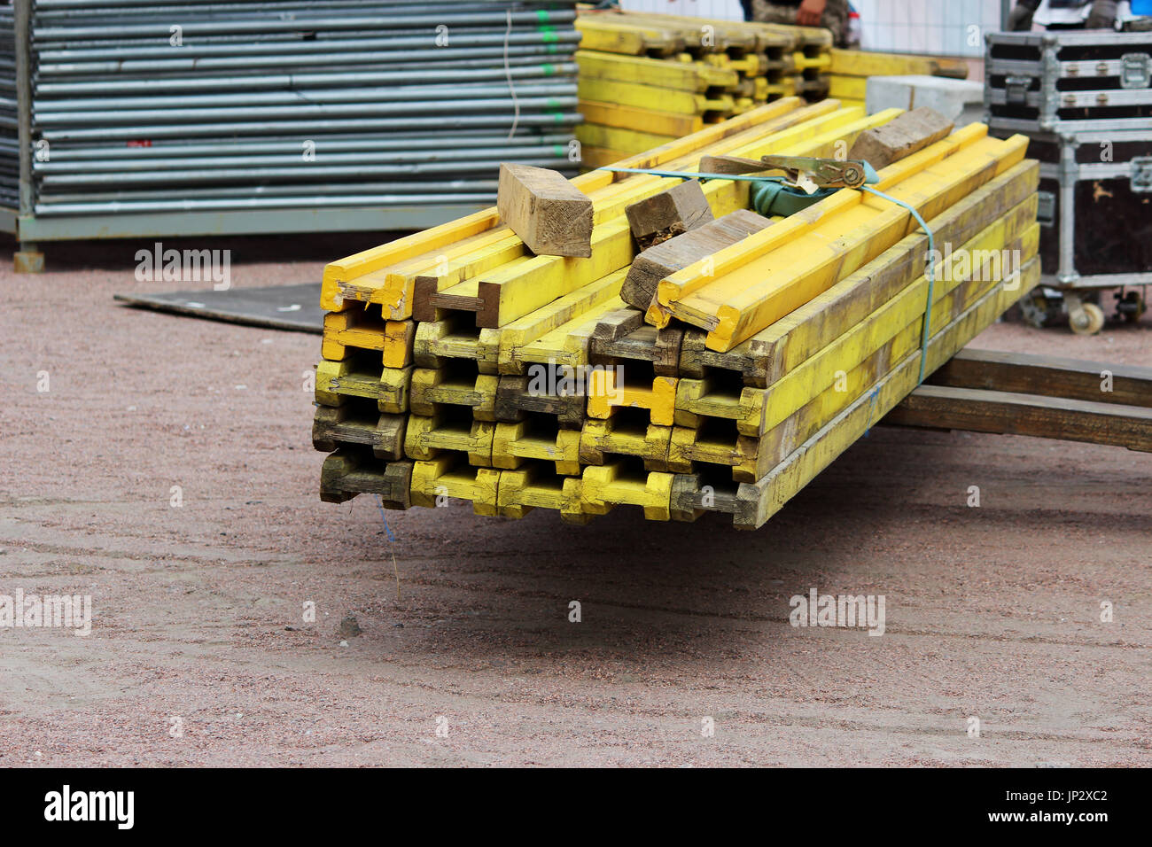 Loader carries I-beams, used to mount the formwork for subsequent ...