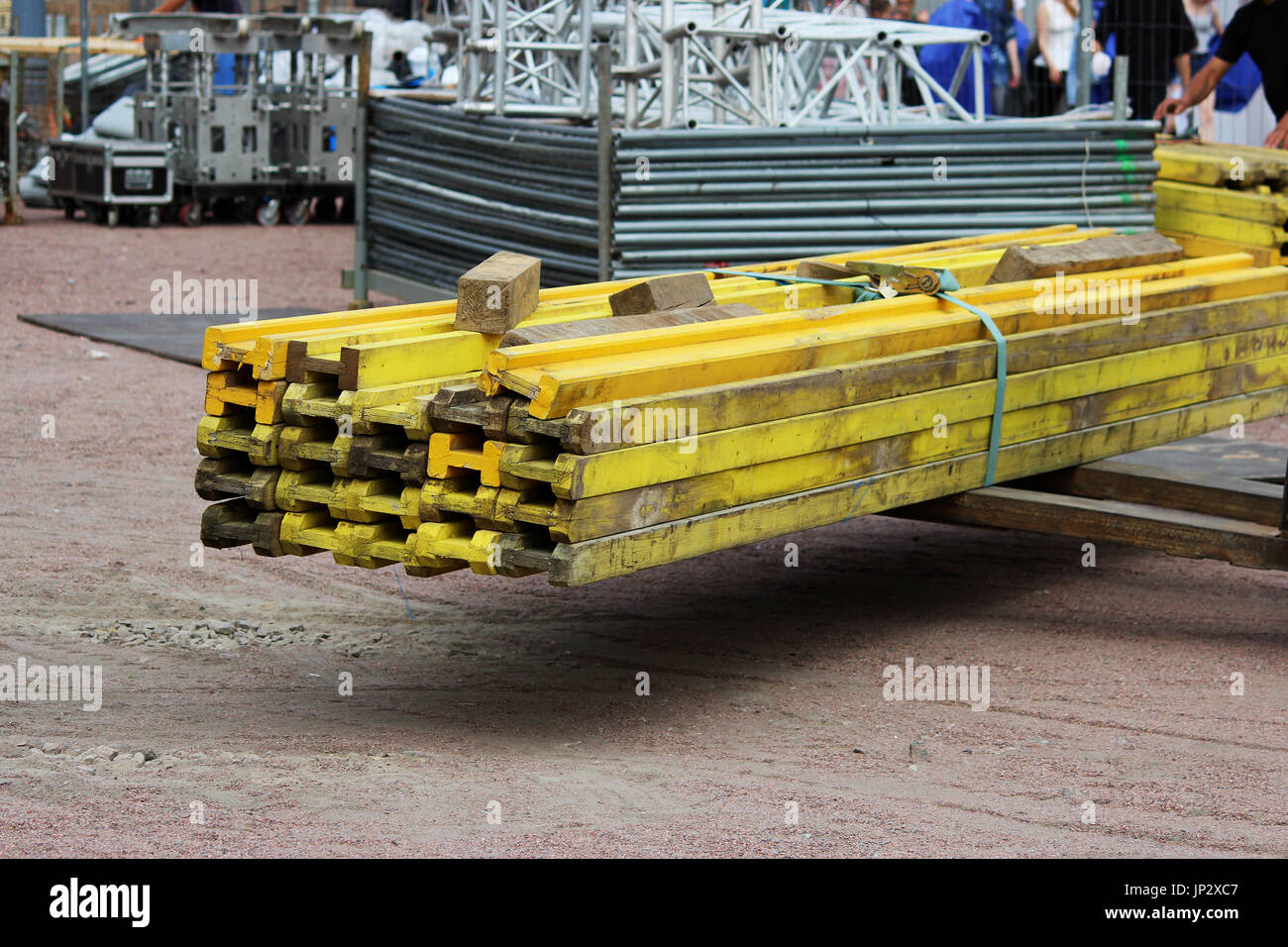 Loader carries I-beams, used to mount the formwork for subsequent ...