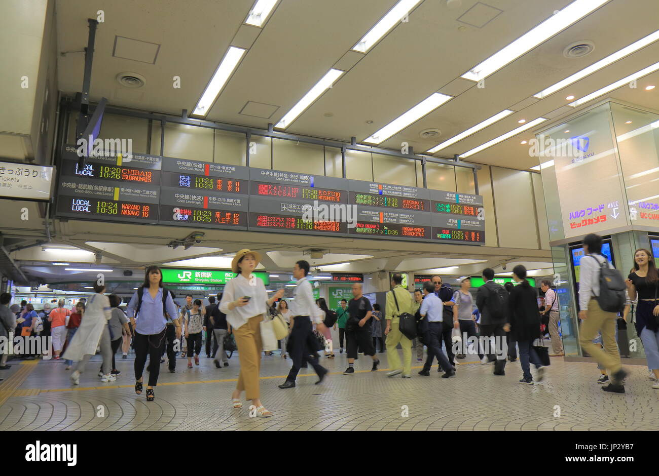 People commute at Shinjuku train station in Tokyo Japan Stock Photo - Alamy