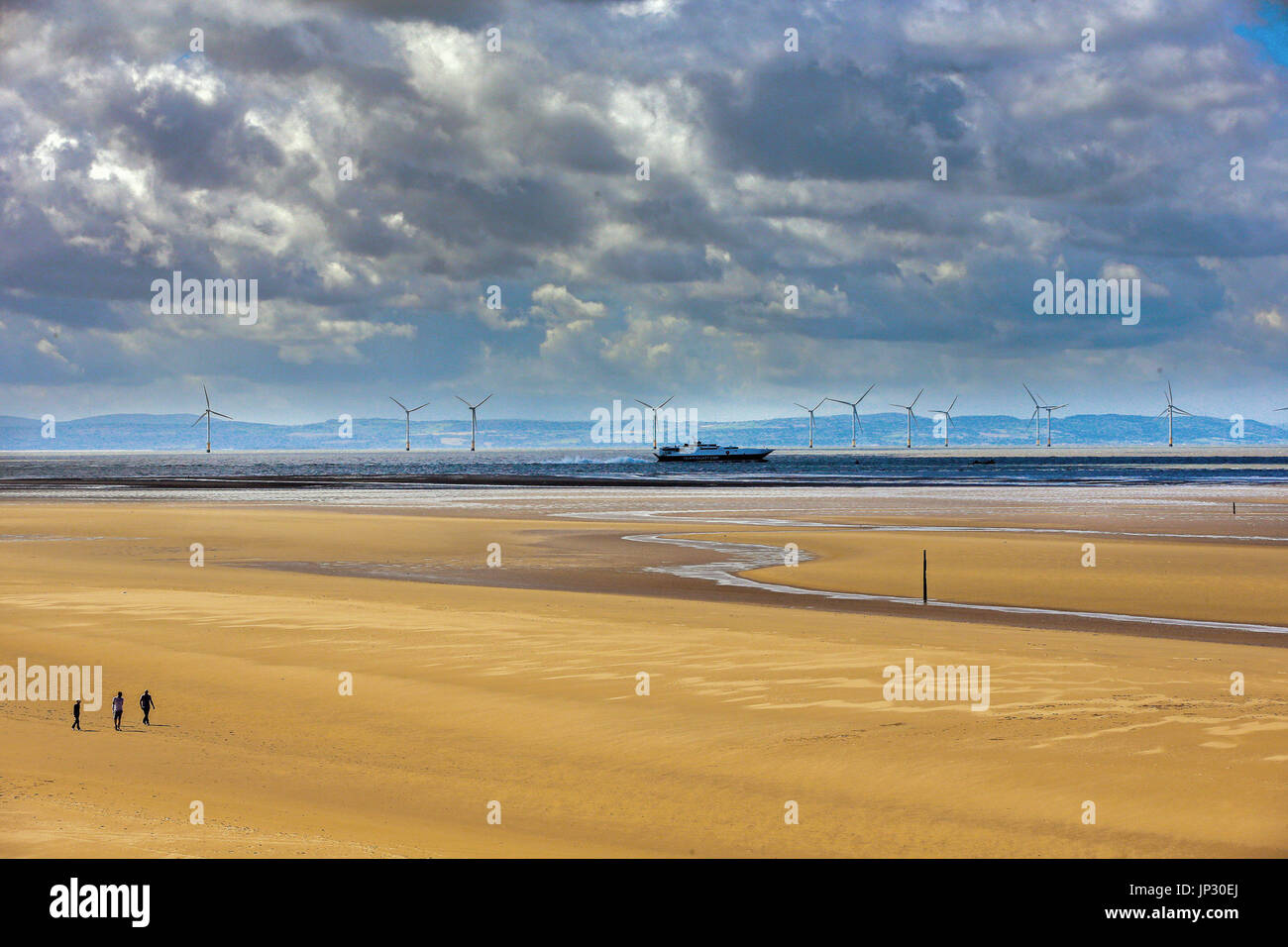 The Steam Packet company ferry leaves Liverpool as a family walk along ...