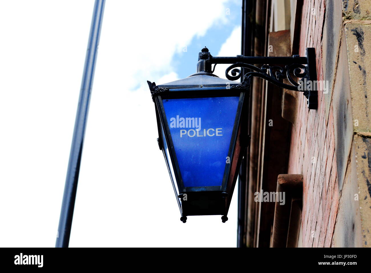 Traditional style police lantern outside police station Stock Photo - Alamy
