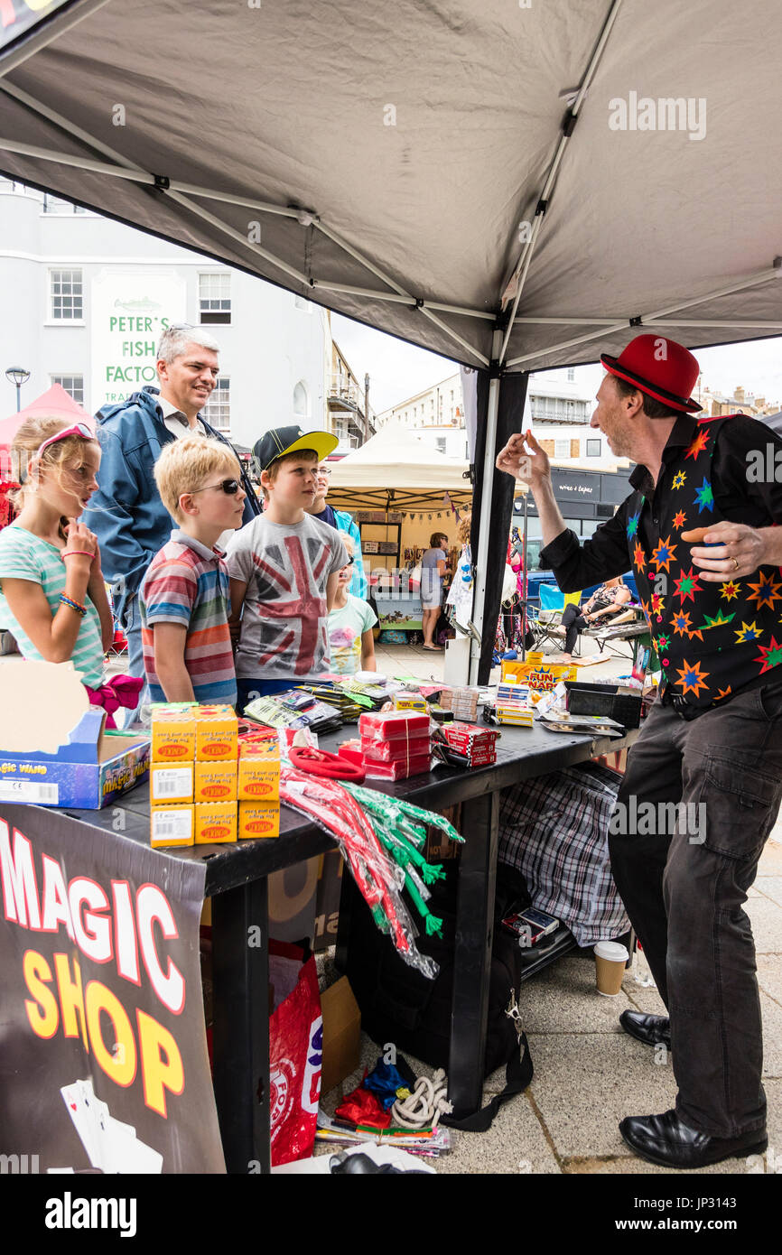 Open market stall with magic tricks on. Zenea, local magician ...