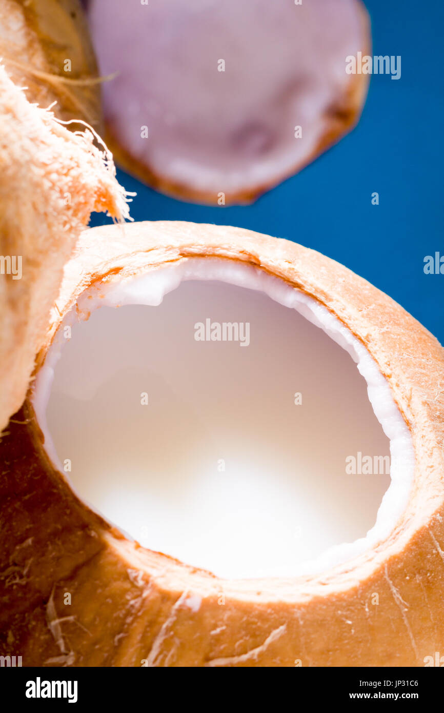 Open young coconut with fresh cocos water Stock Photo - Alamy