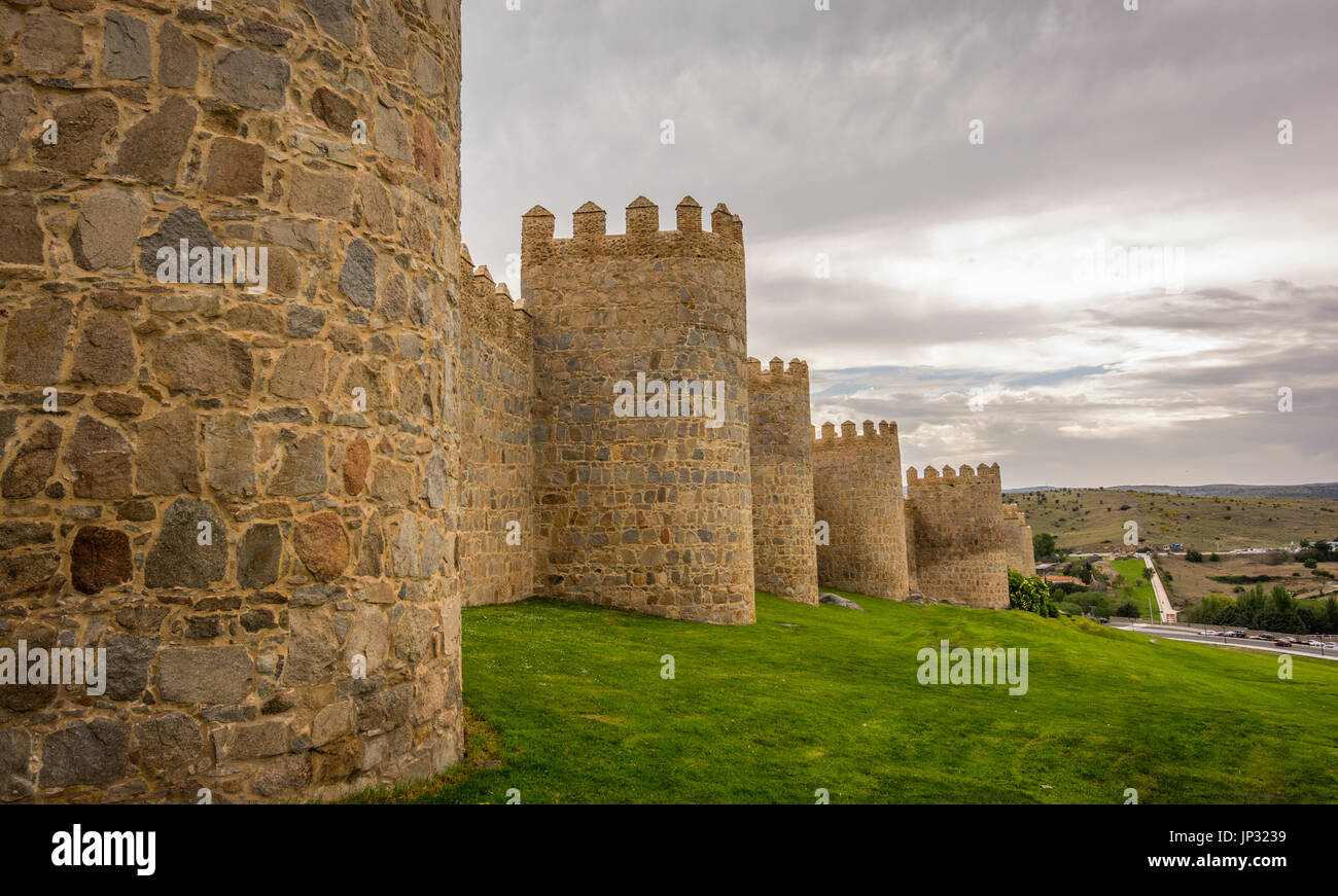 Walls of the historic city of Avila,at the blue hour, in Spain. the old ...
