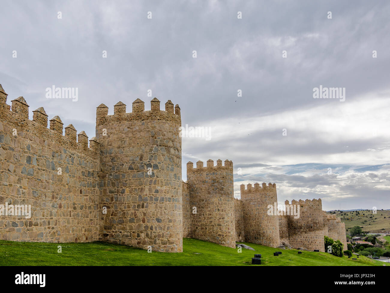 Walls of the historic city of Avila,at the blue hour, in Spain. the old ...