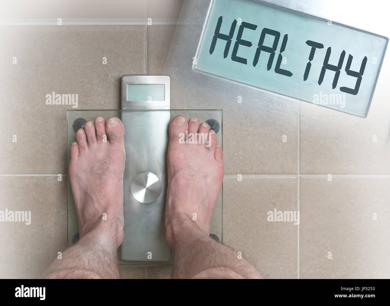 Closeup of man's feet on weight scale - Healthy Stock Photo - Alamy