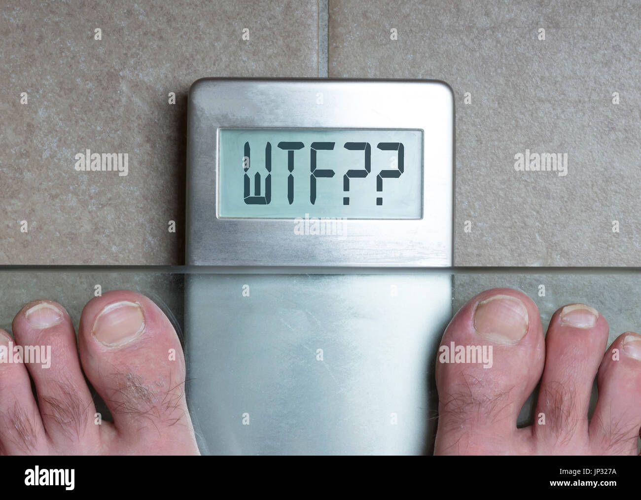 Closeup of man's feet on weight scale - WTF!!! Stock Photo - Alamy