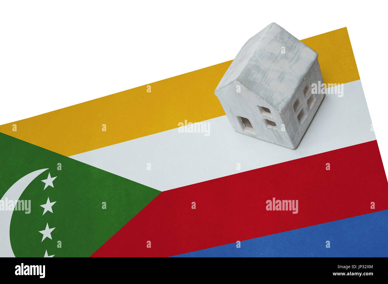 Small house on a flag - Living or migrating to Comoros Stock Photo - Alamy