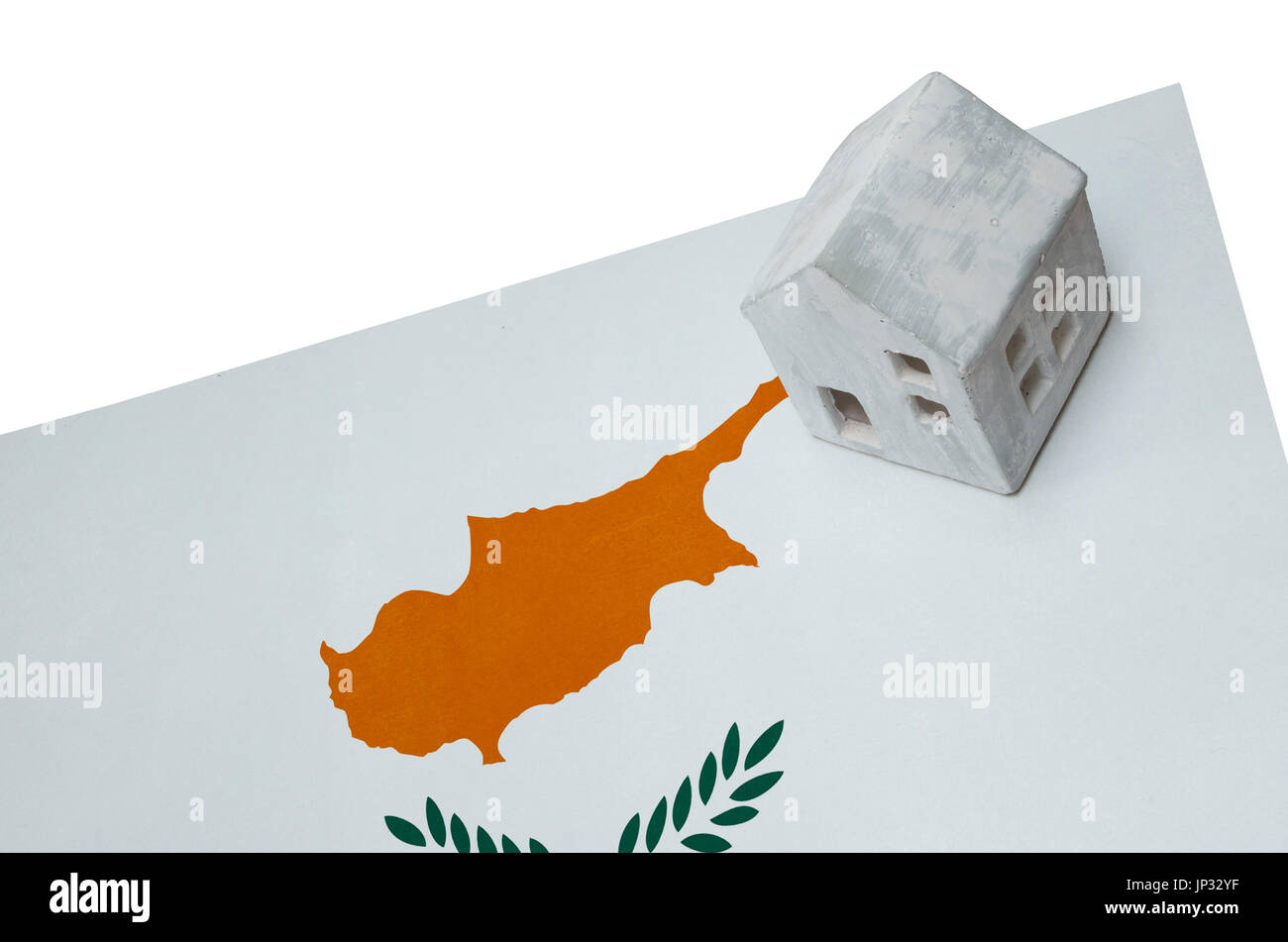 Small house on a flag - Living or migrating to Cyprus Stock Photo - Alamy