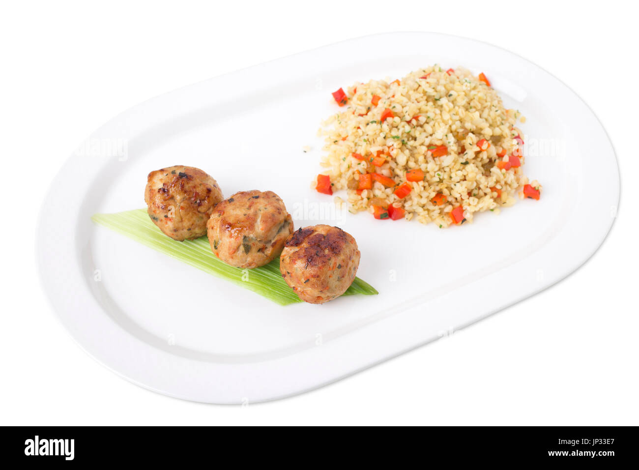 Turkey meatballs with delicious bulgur. Isolated on a white background ...