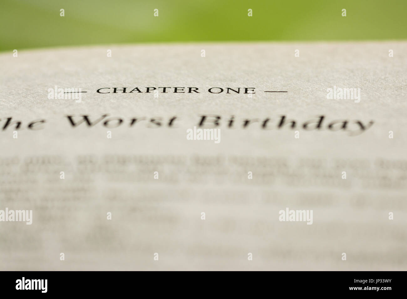 closeup Chapter ONE in English book with another words blurry Stock ...