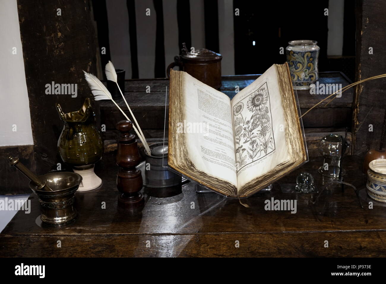 Antique medieval book on a desk with quill pens and other antique ...