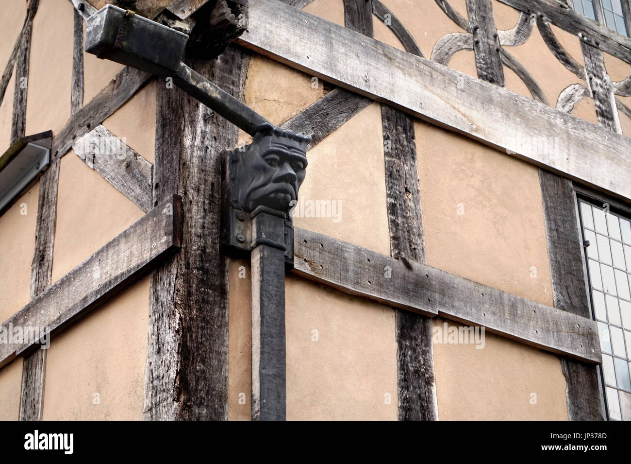 Traditional gargoyle style rainwater gully on a tudor timber framed ...