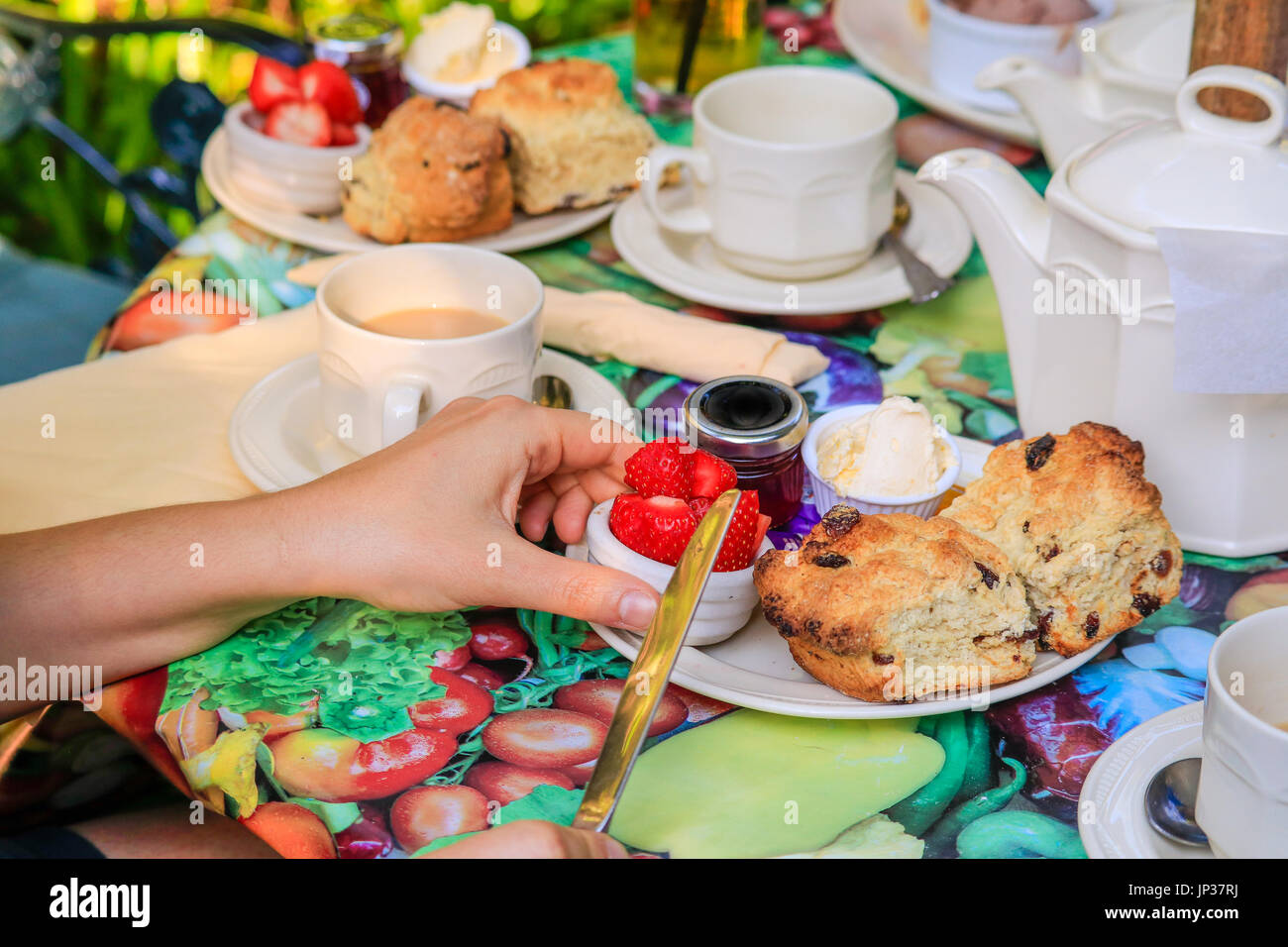 Traditional English tea in an outdoors tea house Stock Photo - Alamy