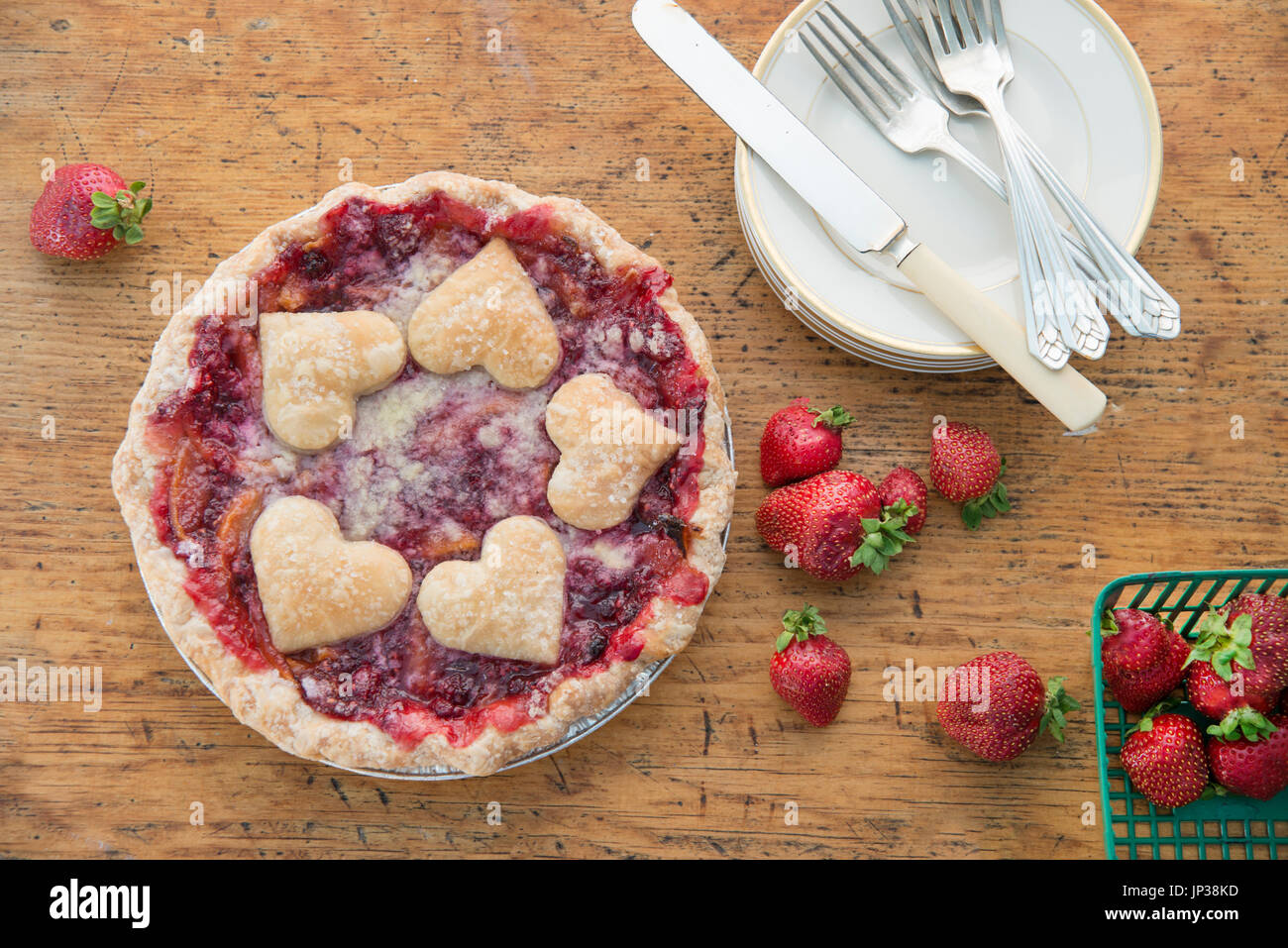 Heart shaped dough on berry pie ready to serve Stock Photo - Alamy