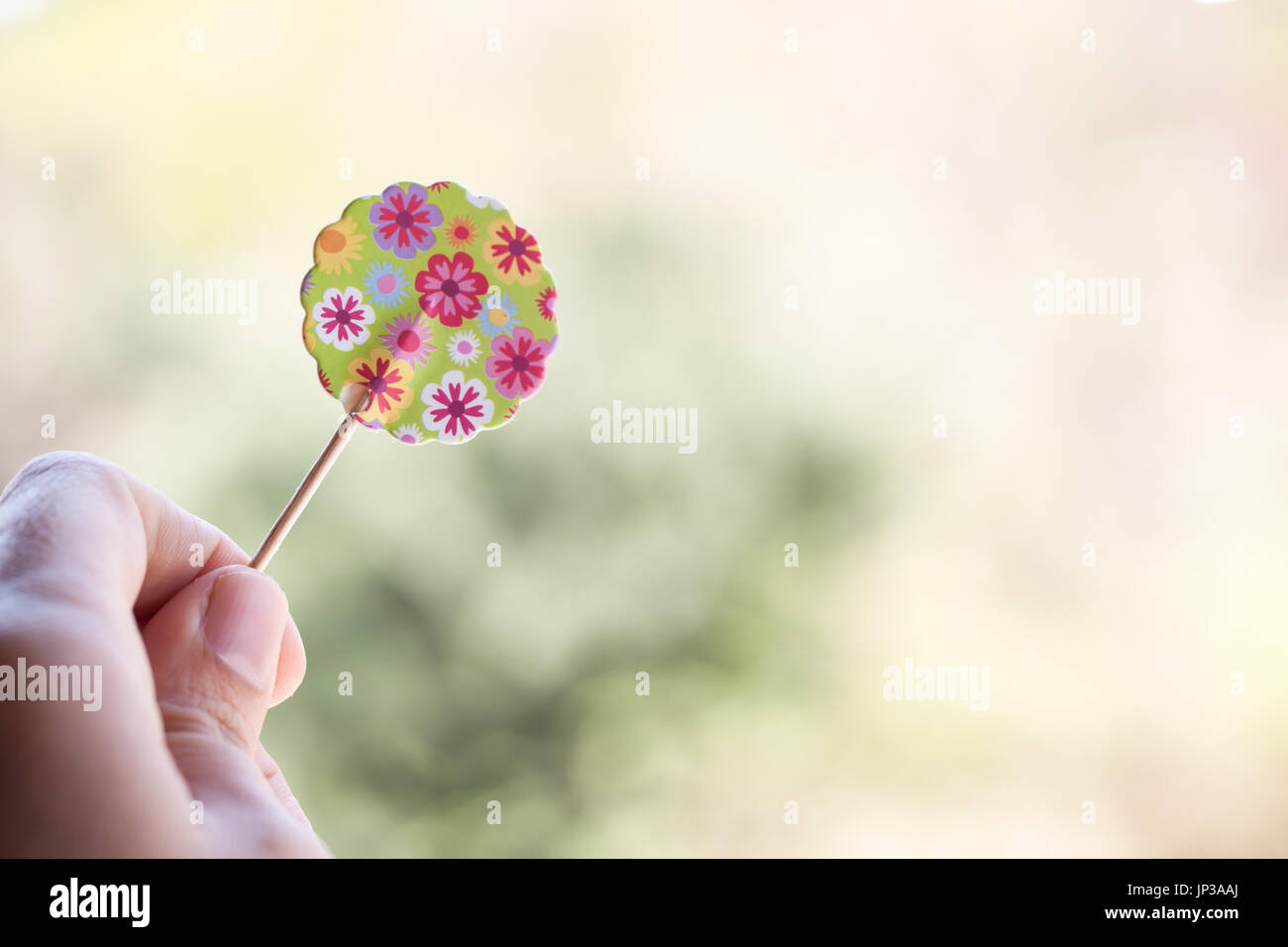 hand holding paper flower Stock Photo - Alamy